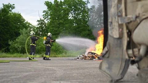 Firefighters fight the fire flame to con... | Stock Video | Pond5