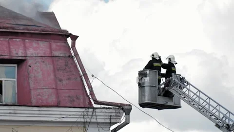 Firefighters on fire lift with fire hose... | Stock Video | Pond5