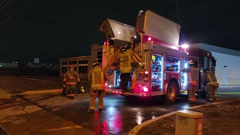 Firefighters load up fire truck and pack... | Stock Video | Pond5