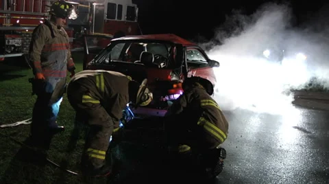 Firefighters trying to rescue car accide... | Stock Video | Pond5