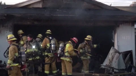 firefighters working a house fire | Stock Video | Pond5