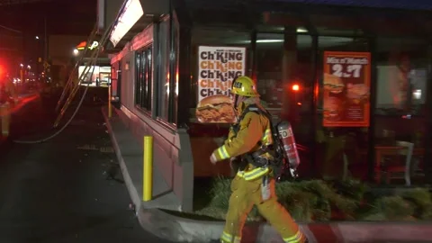 firefighters working a structure fire | Stock Video | Pond5