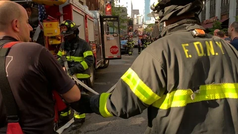 firefighters working together - FDNY wor... | Stock Video | Pond5