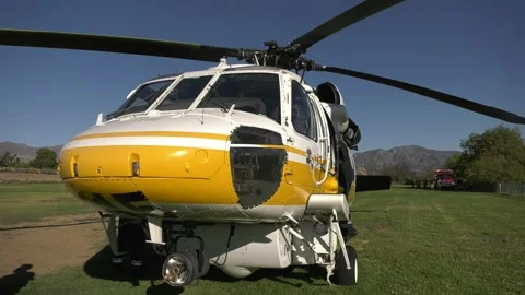 firefighting helicopter parked on ramp | Stock Video | Pond5