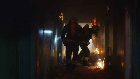 Firemen looking for survivors in burning... | Stock Video | Pond5