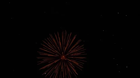 Fireworks explode leaving trails of shim... | Stock Video | Pond5