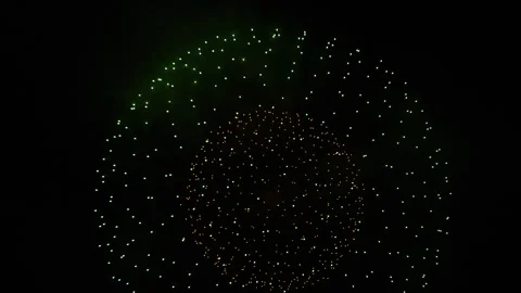 Fireworks explode into round ball in dar... | Stock Video | Pond5