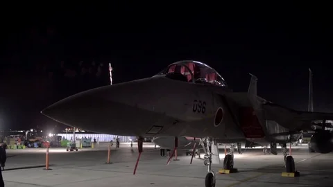 Fireworks at night behind a fighter jet ... | Stock Video | Pond5