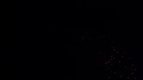 Fireworks suddenly fill the dark night s... | Stock Video | Pond5