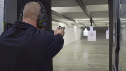 Firing Pistol Indoor Gun Range | Stock Video | Pond5