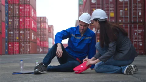 First aid for a container warehouse work... | Stock Video | Pond5