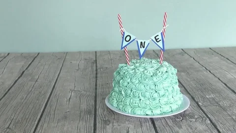 first birthday cake smooth rotating view... | Stock Video | Pond5
