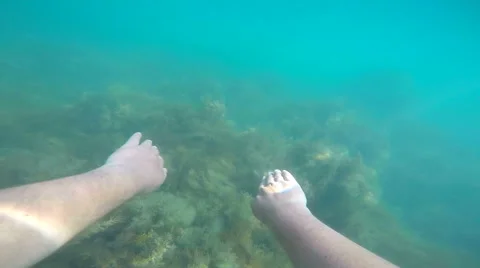First-person POV man swimming underwater... | Stock Video | Pond5