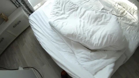 First person view, man making the bed at... | Stock Video | Pond5