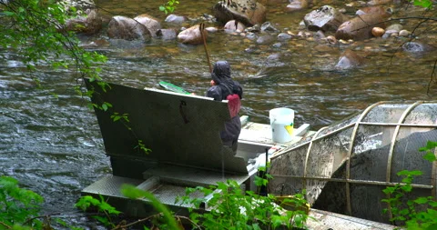 Fish rotary screw trap in stream | Stock Video | Pond5