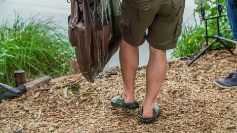 Fish is still alive and he is putting it... | Stock Video | Pond5