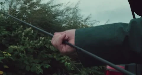 Fisherman attaches his rod and gets read... | Stock Video | Pond5