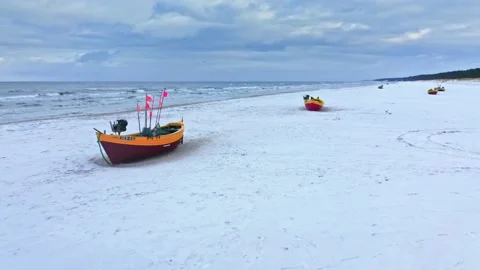 Fishing boat on snowy beach, winter Balt... | Stock Video | Pond5