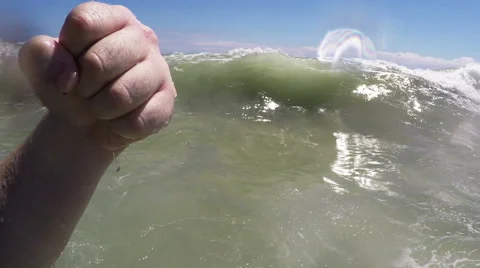 Fist to Ocean Waves the Wave Won with Un... | Stock Video | Pond5