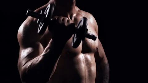 Fit and sporty bodybuilder over black ba... | Stock Video | Pond5