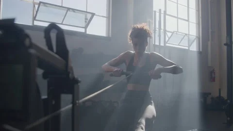 Fit Woman Concentrating as She Rows at t... | Stock Video | Pond5