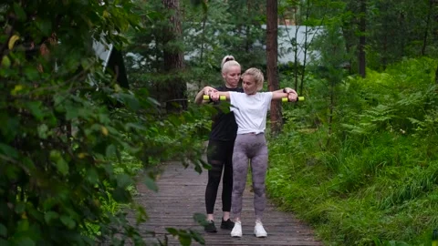 Fitness. Personal trainer taking notes w... | Stock Video | Pond5