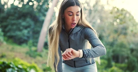 Fitness, woman and runner check time in ... | Stock Video | Pond5