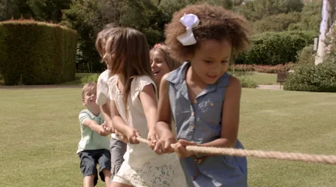 Five children pulling rope having tug of... | Stock Video | Pond5