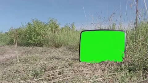 Fixed Shot Old Tv Set on the grass With... | Stock Video | Pond5