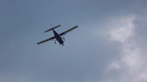 Fixed wing monoplane flies overhead on a... | Stock Video | Pond5