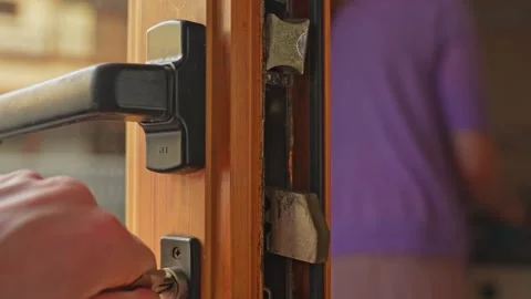 Fixing house wooden door lock torn apart | Stock Video | Pond5