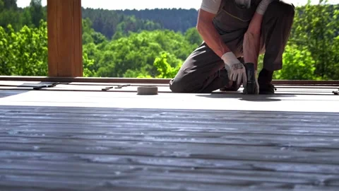 Fixing of wooden terrace boards with tre... | Stock Video | Pond5