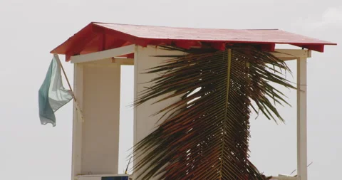 Flag Blowing In The Wind At Lifeguard Sh... | Stock Video | Pond5