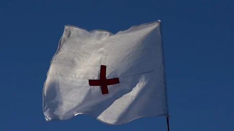 Flag of Red Cross developing in wind on ... | Stock Video | Pond5