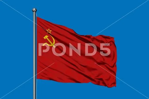 Flag of Soviet Union waving in the wind against deep blue sky. USSR ...