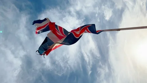 Flag of the torn flag of England is wavi... | Stock Video | Pond5