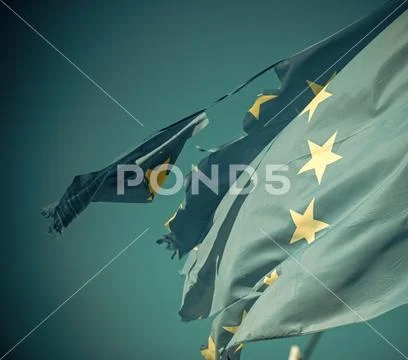 Flag is torn off at side, symbol of problems, decay, disintegration ...