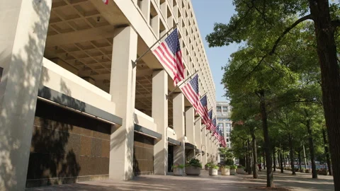 Flags hanging along sidewalk outside of ... | Stock Video | Pond5