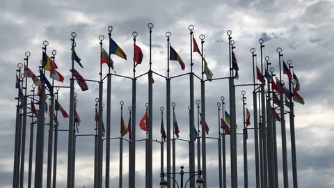 Flags of various countries in the cloudy... | Stock Video | Pond5