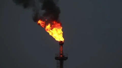 Flame and smoke from gas flare tower ove... | Stock Video | Pond5