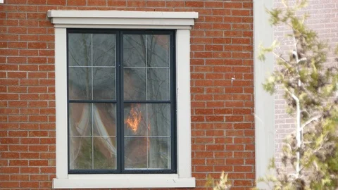 Flame seen burning through clear window ... | Stock Video | Pond5