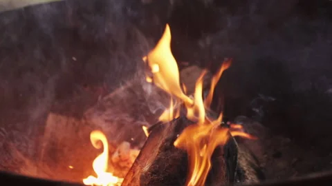 Flames and smoke rising from a fire pit ... | Stock Video | Pond5