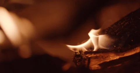 Flames roll off tip of log with fire in ... | Stock Video | Pond5