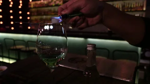 Flaming absinthe cocktail drink burn fir... | Stock Video | Pond5