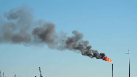 Flaring off gas at an oil refinery. Larg... | Stock Video | Pond5