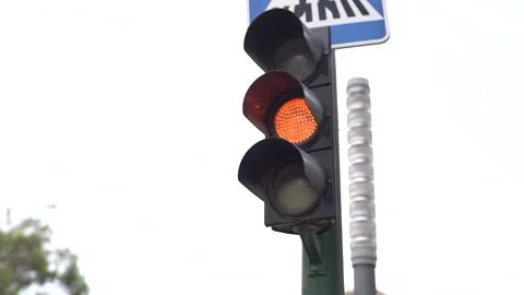 Flashing yellow traffic light close-up o... | Stock Video | Pond5