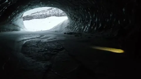 Flashlight Exploring Dark Cave | Stock Video | Pond5