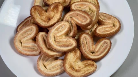Flat puff pastry butterfly cookies on di... | Stock Video | Pond5
