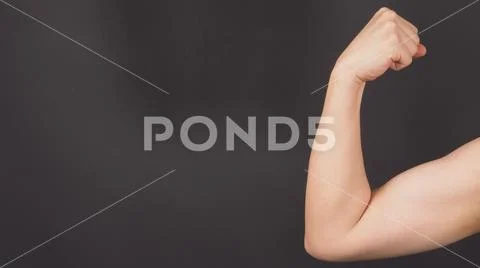 The Flexing or Strong Arm Hand Sign on black background. ~ Hi Res ...