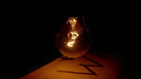 Flickering Lamp Lights Up over a Drawing... | Stock Video | Pond5